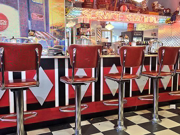 Chrome and red vinyl stools at the counter where solo diners become part of the Nutcracker family. Spin at your own risk.