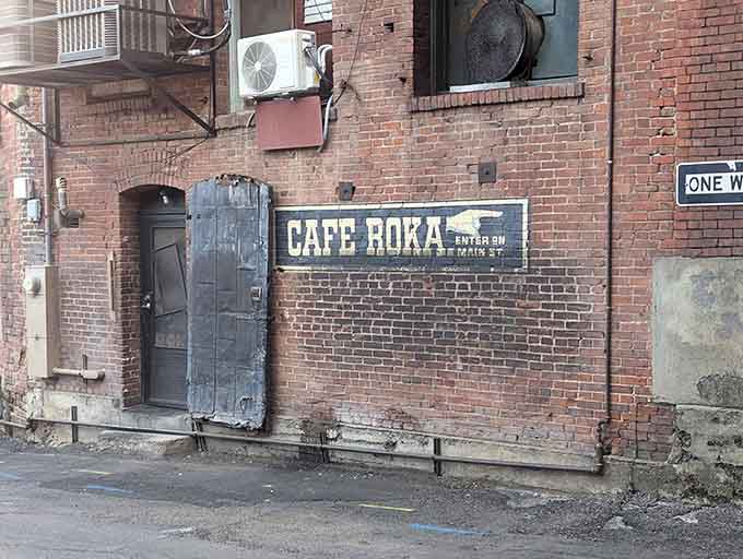 Caf&eacute; Roka's weathered brick exterior and vintage signage hint at the culinary magic happening inside, where dinner becomes an event worth planning your day around.