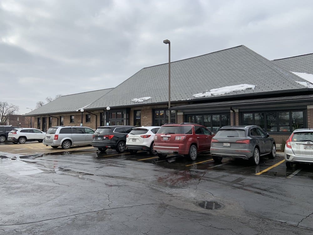 A full parking lot signals what locals already know: something special is happening inside, and it involves exceptional sweet potato fries.