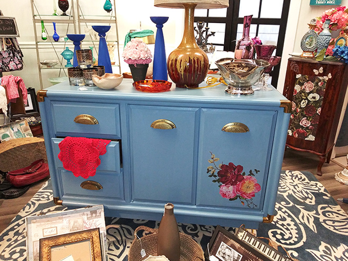 This blue credenza with floral detailing isn't just furniture &ndash; it's a statement piece that whispers "why settle for ordinary when extraordinary exists?"