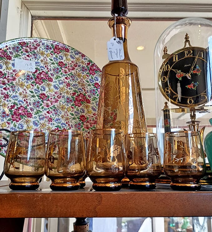 Amber glassware catches light like liquid honey, transforming ordinary drinks into special occasions through the alchemy of vintage Bohemian craftsmanship.