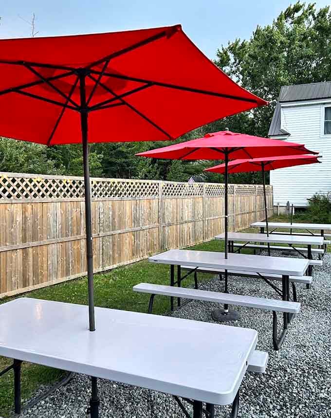 Red umbrellas and picnic tables create the perfect setting for enjoying fresh seafood while pretending you're on a permanent vacation.