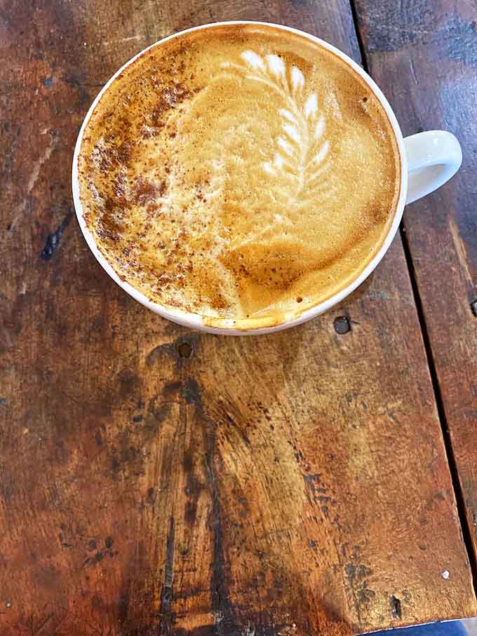 This latte, dusted with nutmeg atop perfectly foamed milk, isn't just a beverage &ndash; it's a warm hug in ceramic form.