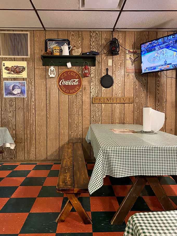 That Coca-Cola sign and cast-iron skillet on the wall represent the kind of authentic decor that develops naturally over decades.