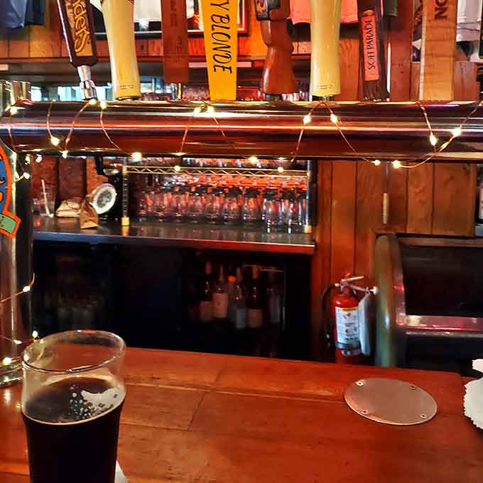 The bar area glows with warm light and cold beer, where strangers become friends over shared stories and Michigan craft brews.