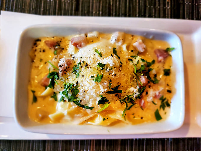 Creamy pasta that hugs each piece of pancetta like they've been separated for years. Comfort food with a college degree.