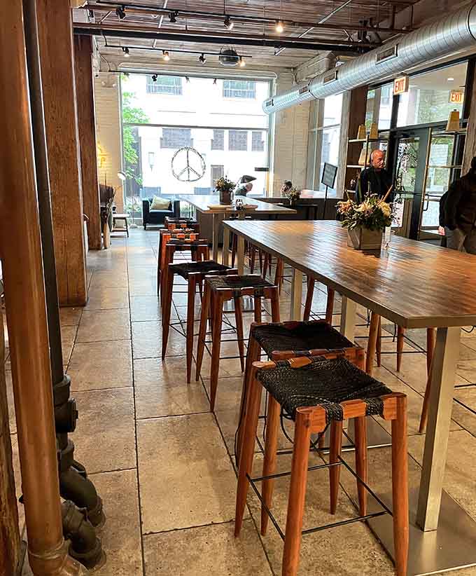 The communal table and cozy seating invite you to settle in for a while, maybe order a second coffee, definitely consider another sandwich.