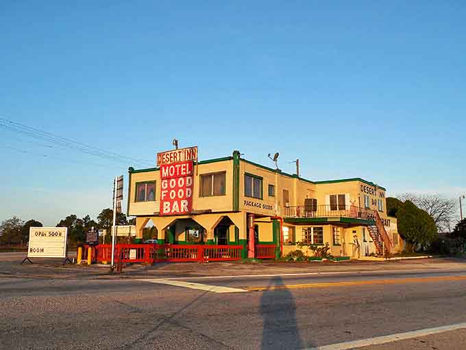 Golden hour light bathes the Desert Inn Motel in warm hues, highlighting the vintage architecture that earned this landmark a spot on the National Register of Historic Places.