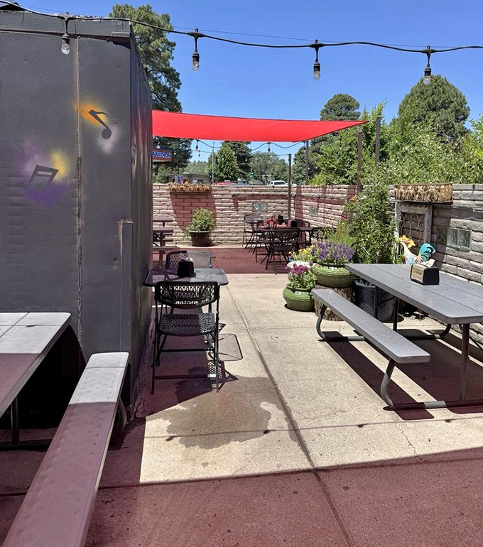 The outdoor patio at Satchmo's offers the perfect Arizona dining experience—simple tables, string lights, and the promise of BBQ under the big sky.