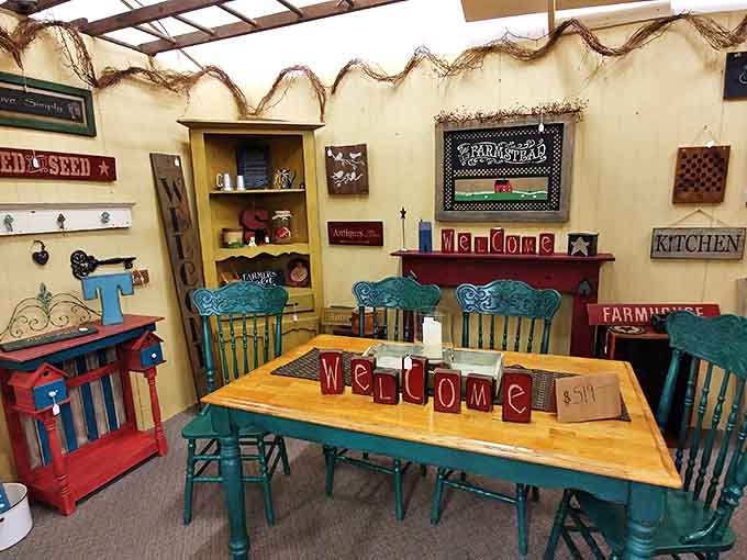 A farmhouse dining setup that Joanna Gaines would approve &ndash; rustic charm meets practical gathering space with vintage-inspired "welcome" blocks.