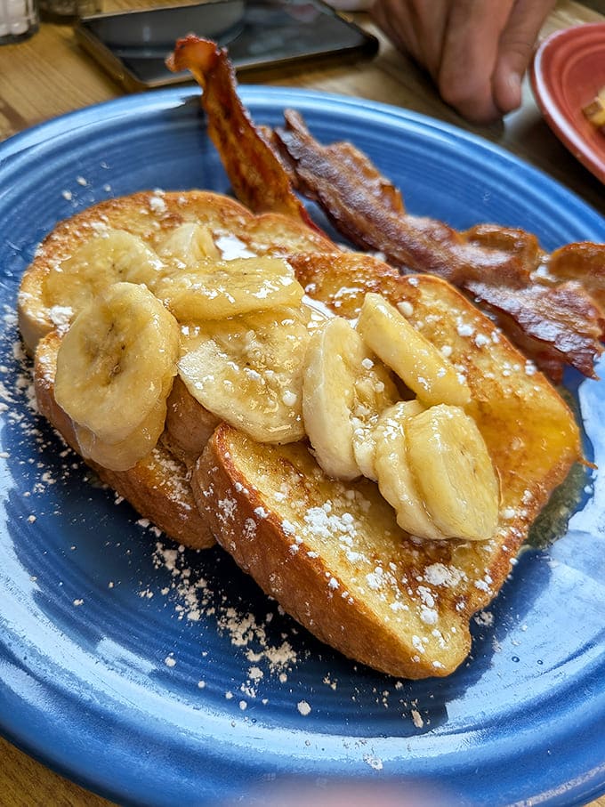 Thick French toast topped with fresh banana slices and powdered sugar turns a simple breakfast into something almost magical.