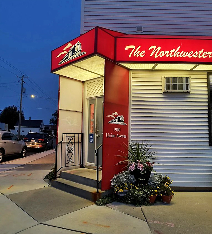The welcoming entrance glows like a beacon for hungry travelers &ndash; a red-signed promise of butter-soaked delights within.