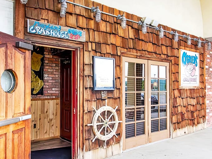 Entrance: The wooden-shingled entryway, complete with ship's wheel, sets the stage for the coastal experience waiting inside.