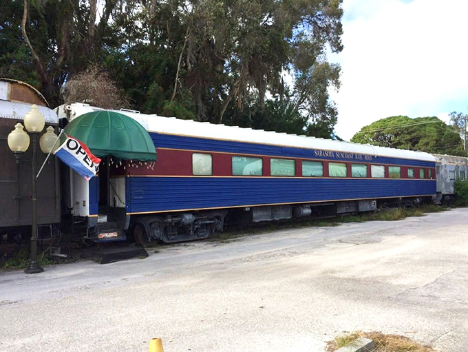 The bright blue car beckons with promises of unique dining adventures. Not your average restaurant entrance!
