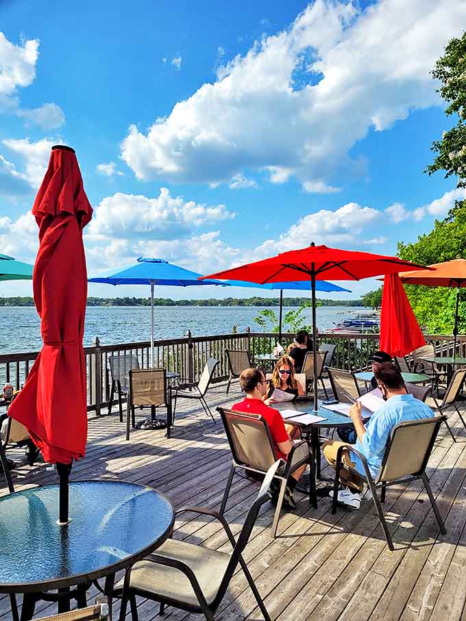 The lakefront deck where summer memories are made&mdash;under colorful umbrellas that frame Cedar Lake's sparkling waters like a living postcard.