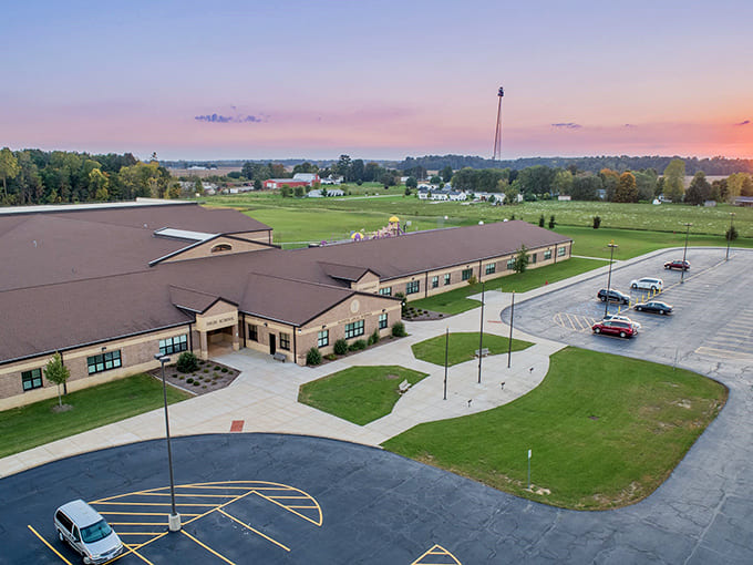 The school stands as the heart of the community, where future generations learn in facilities that blend tradition with modern education.