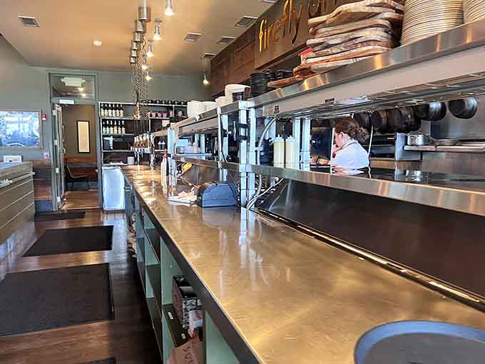 The gleaming kitchen operates like a well-choreographed dance, where fresh ingredients transform into the dishes that keep people coming back for more.