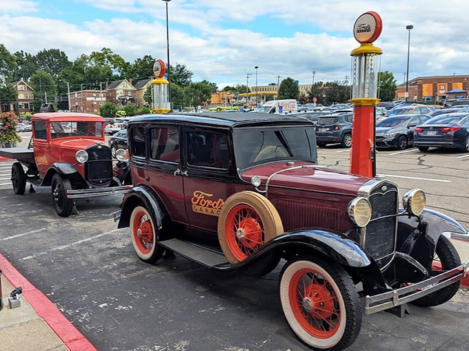 Vintage Ford vehicles parked outside continue the theme beyond the restaurant walls, offering perfect photo opportunities and setting expectations for the automotive wonderland inside.
