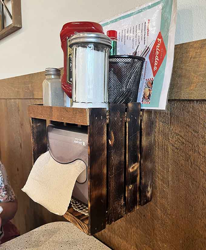 These wooden organizers holding napkins and condiments have probably witnessed more meals than most restaurants serve in a year, and they're still going strong.