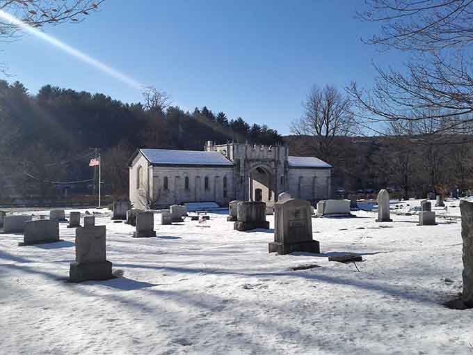 Winter transforms the cemetery into a stark landscape where monuments stand out against snow like exclamation points in a very long, very quiet sentence.