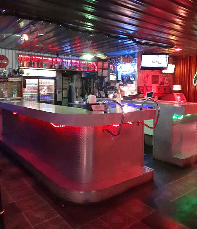 The bar itself gleams with possibility, its metallic surface reflecting the colorful lights that make every visit feel like a celebration.