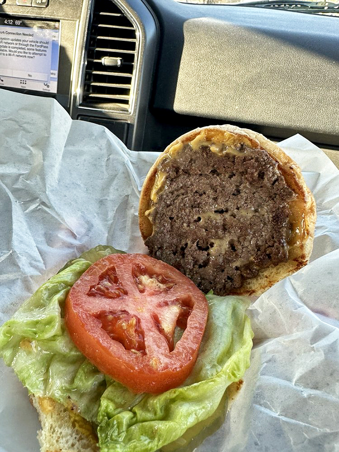 Behold, the burger in its natural habitat! This hand-held masterpiece is proof that sometimes, simplicity is the ultimate sophistication.