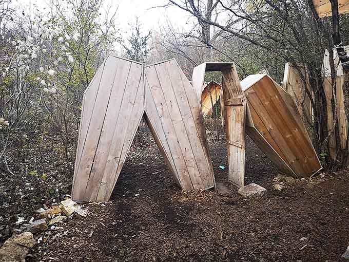 These coffins standing upright suggest someone got tired of traditional burial methods and decided vertical storage made more sense for the undead.