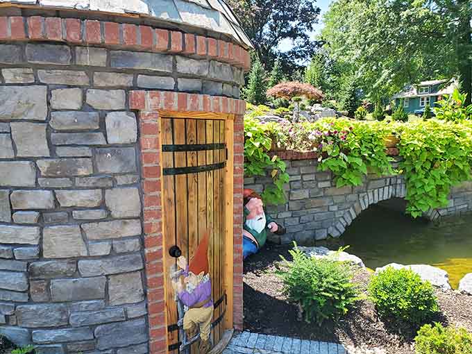 The whimsical scene with its stone tower and hidden doorway looks like hobbits might pop out any second to invite you in for afternoon tea.