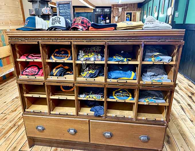Take home a t-shirt to remember your cheese curd pilgrimage, neatly organized in vintage wooden cubbies near the entrance.