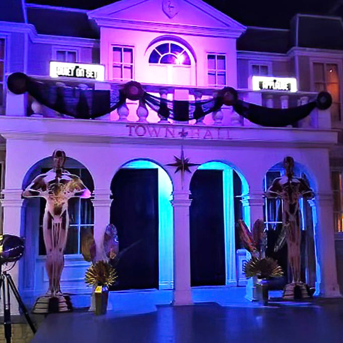 Town Hall transforms into a macabre display with skeletal sentinels standing guard over the entrance to new horrors.
