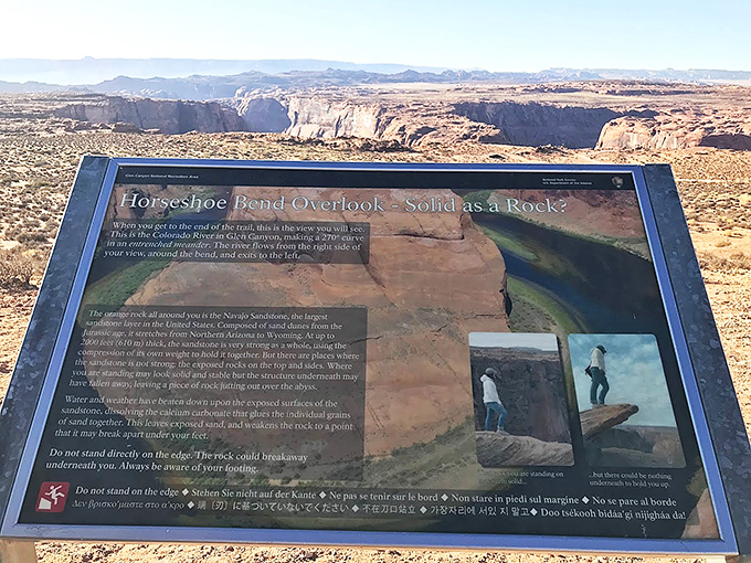 Nature's instruction manual - the informational display explains the geological marvel before you, while subtly suggesting "don't fall off."