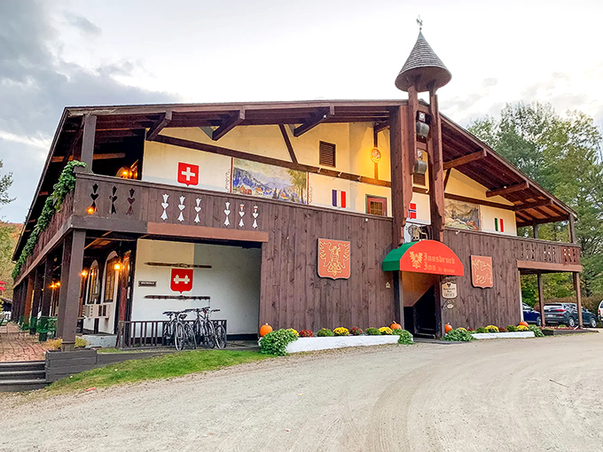 The Innsbruck Inn brings a taste of the Alps to Vermont, where Swiss flags flutter against a backdrop of American autumn.