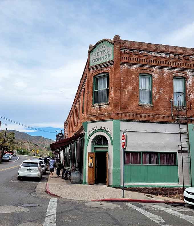 Hotel Connor's brick facade has welcomed guests since Jerome's mining heyday, offering modern travelers a chance to sleep where miners, merchants, and madams once made history.