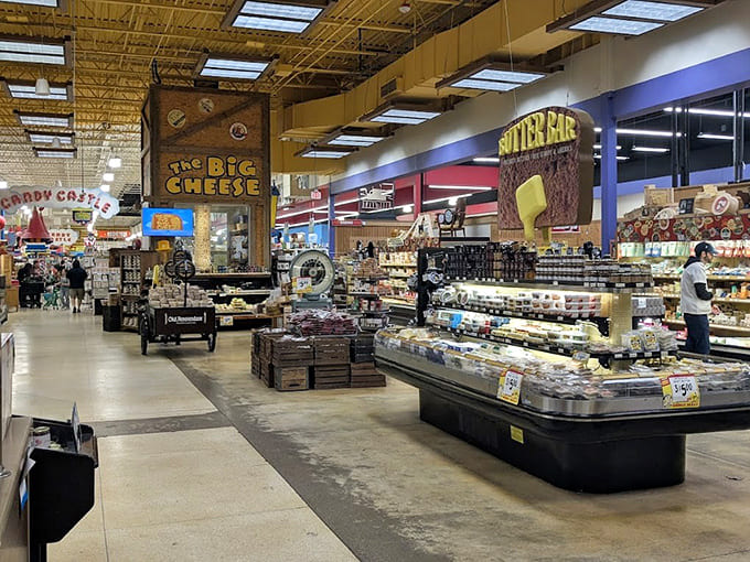 The interior sprawls endlessly, combining cheese displays with whimsy in ways that defy conventional retail logic completely.