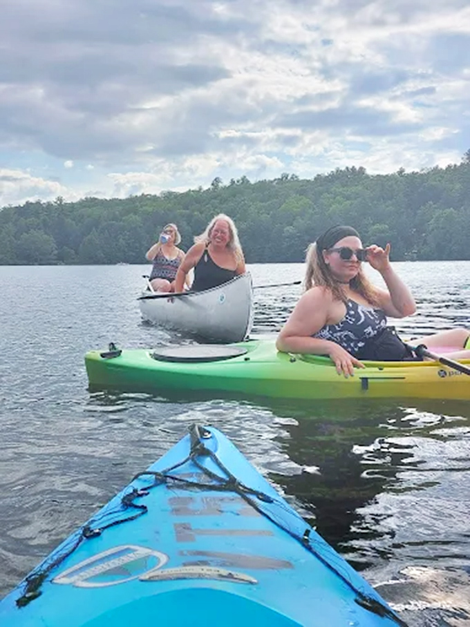 Kayakers explore Lake Dunmore's pristine waters, discovering shoreline secrets inaccessible to landlubbers.
