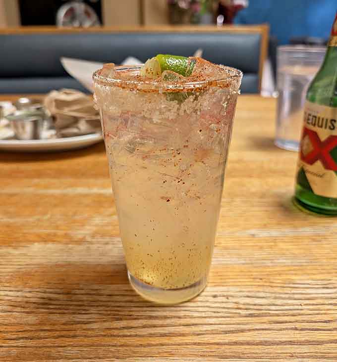 A refreshing beverage with a salted rim, because sometimes your meal needs the perfect drink companion to complete the experience.