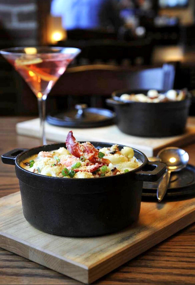 Lobster mac and cheese bubbling in its cast iron cocoon &ndash; comfort food that's had a glamorous makeover but hasn't forgotten its roots.