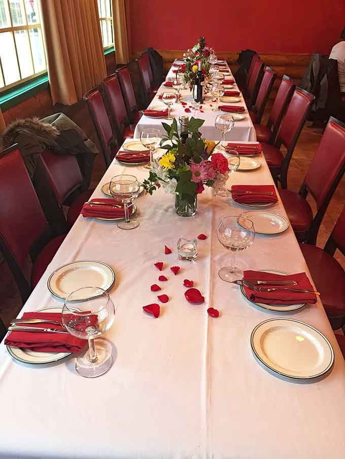 The elegant table setting for special occasions shows Luna di Luna can dress up when needed, complete with rose petals and wine glasses ready for celebration.