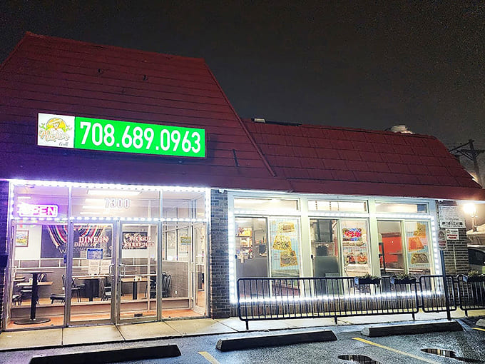 Even after dark, that glowing sign beckons hungry travelers, promising warm food and warmer hospitality inside those welcoming doors.