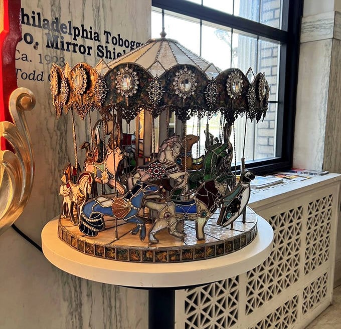 This miniature mirror-adorned carousel is the jewelry box of your childhood dreams, spinning with delicate precision and reflecting a century of craftsmanship.