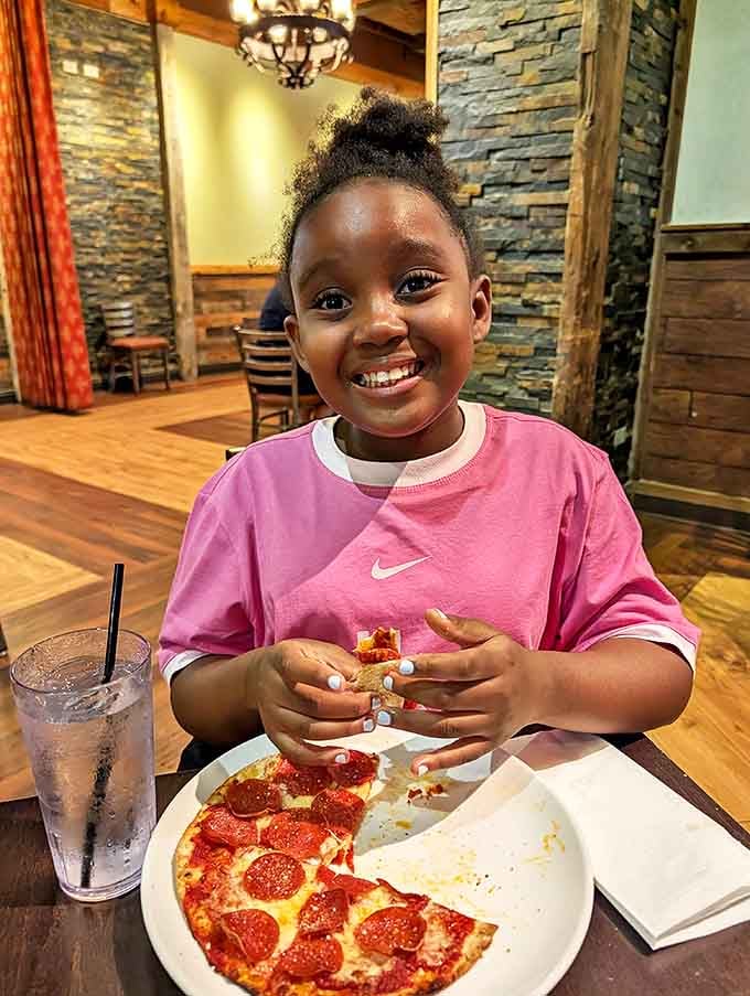 Little guest: The next generation of Chicago food enthusiasts learning the sacred art of pizza appreciation &ndash; training wheels for future beef sandwich devotion.