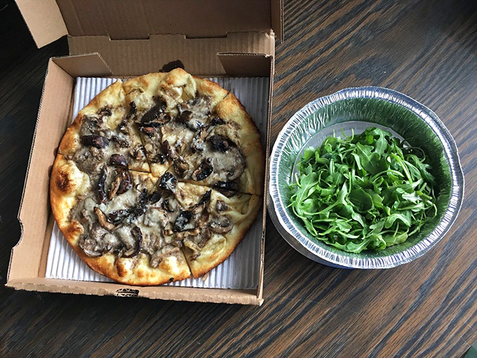 Pizza that puts the "fun" in fungi! This mushroom-topped masterpiece is proof that sometimes, the best things in life are deliciously simple.