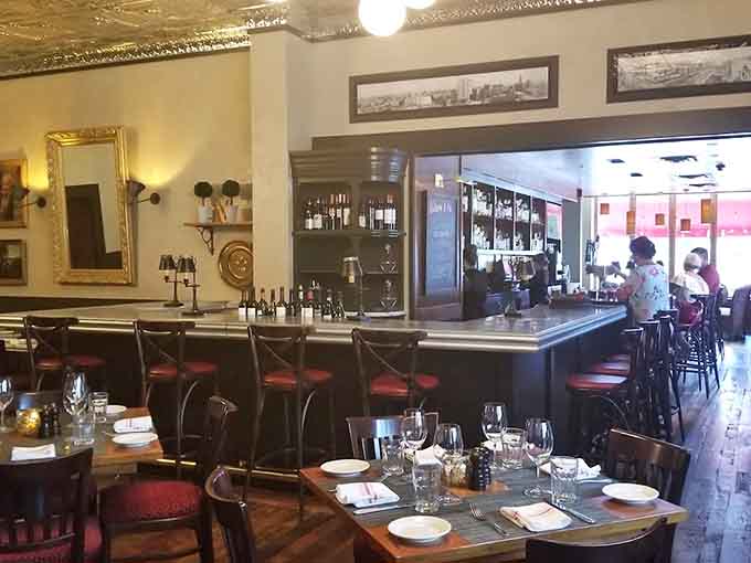 Elegant dining spaces with rich wood paneling create an upscale atmosphere that never feels stuffy or pretentious.