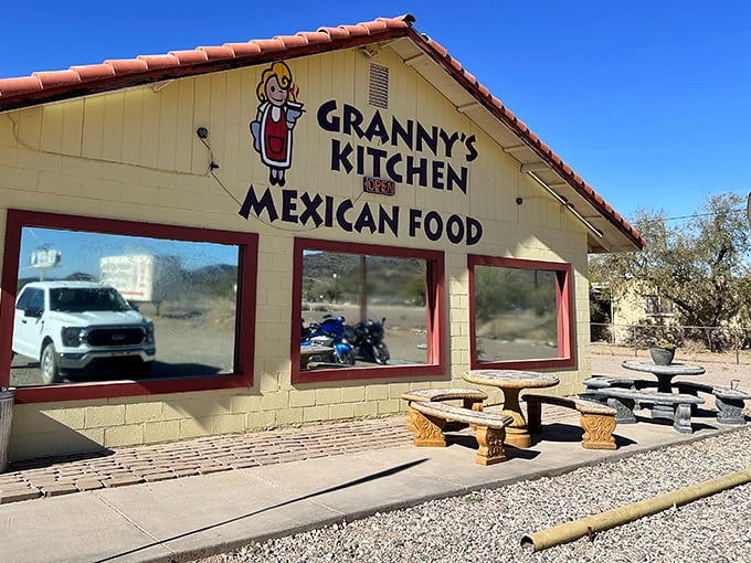Outdoor Patio: Arizona sunshine bathes the simple outdoor seating area, where desert plants provide a perfect backdrop for pre-enchilada anticipation.