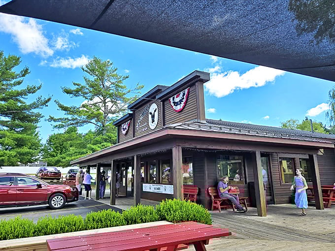 Outdoor Patio: The charming exterior welcomes ice cream enthusiasts with rustic benches and patriotic bunting &ndash; Norman Rockwell would've added this to his "America" collection.