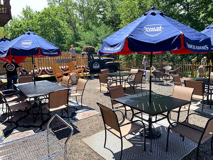 The outdoor seating area offers a perfect summer escape, where blue umbrellas provide shade and every table promises the same exceptional food experience.