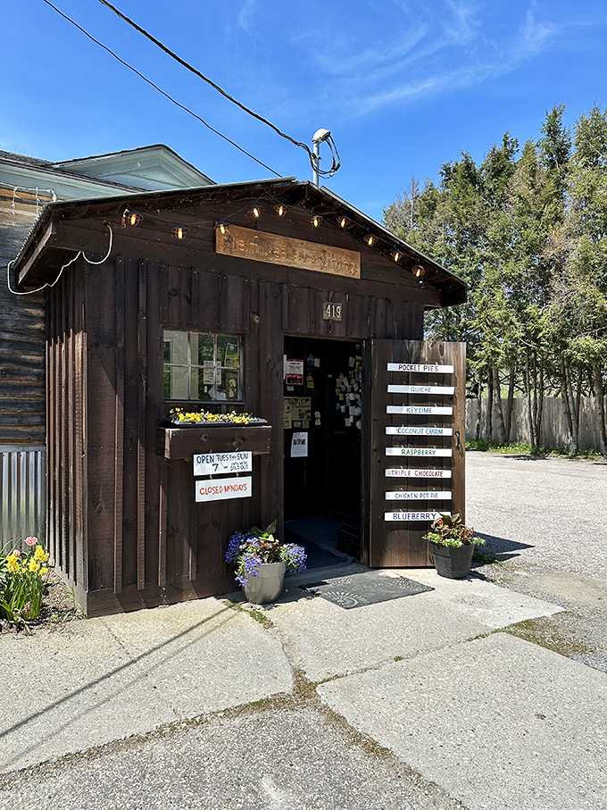 This unassuming wooden structure houses more culinary talent than restaurants with Michelin stars, proving greatness needs no fancy facade.