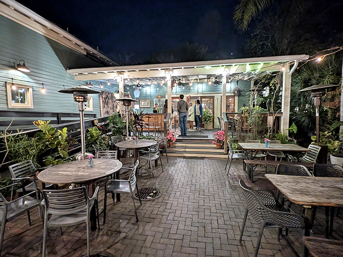 String lights transform this patio into an enchanted garden where Florida evenings become magical dining experiences.