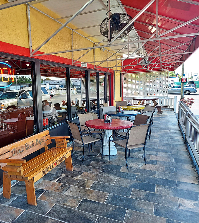 The covered patio offers al fresco dining with Southern charm, perfect for enjoying those famous biscuits with a side of Florida sunshine.