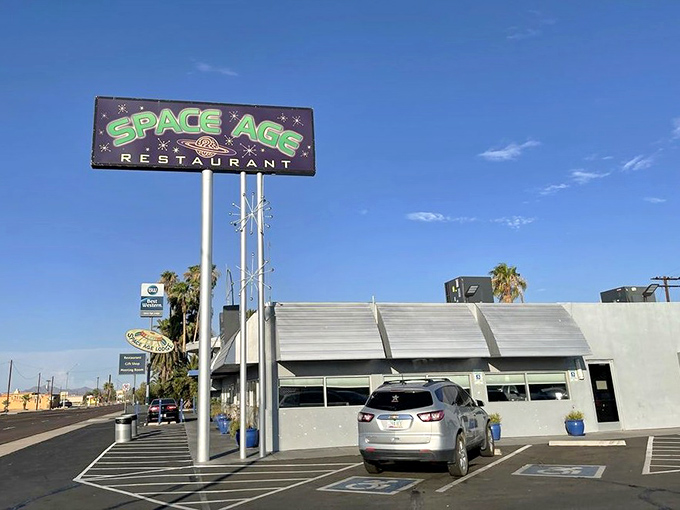 Even the parking lot continues the space theme, with the restaurant's iconic sign standing tall against the clear Arizona sky.